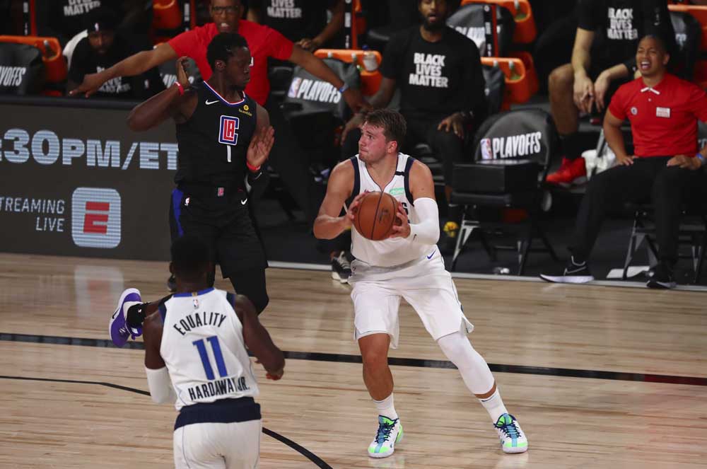 Clippers hold off Doncic, Mavs after Porzingis is tossed | Tyler ...